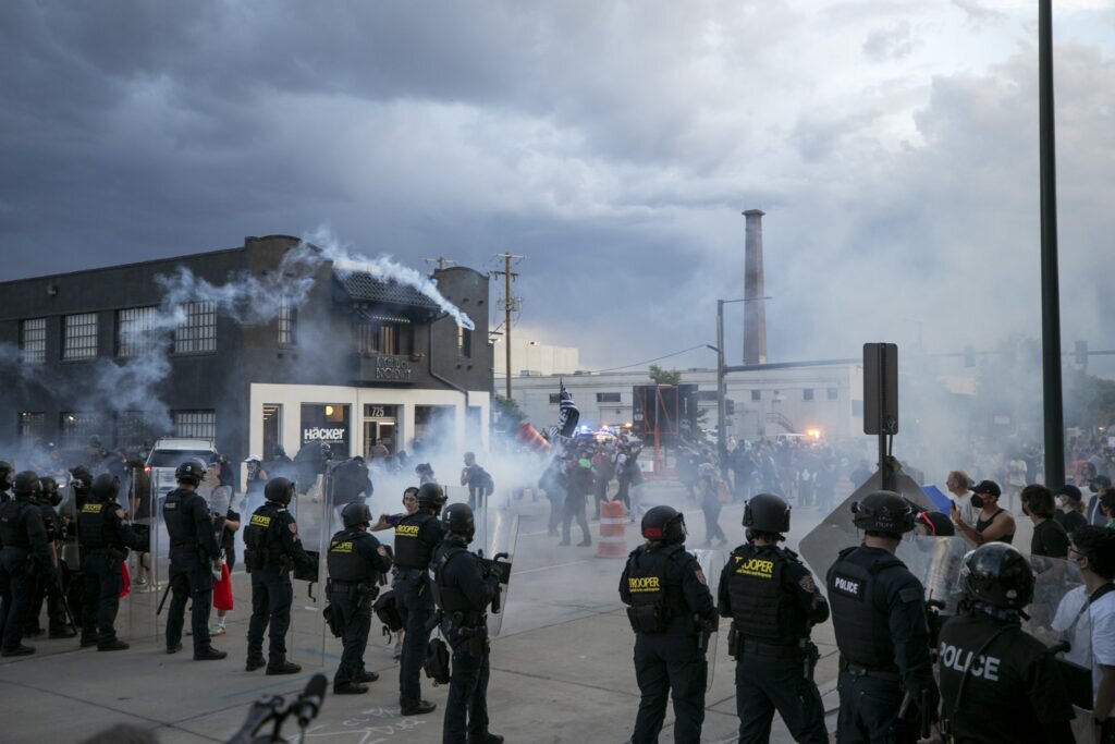Protesters rally against ICE at Colorado Capitol as police use smoke ...