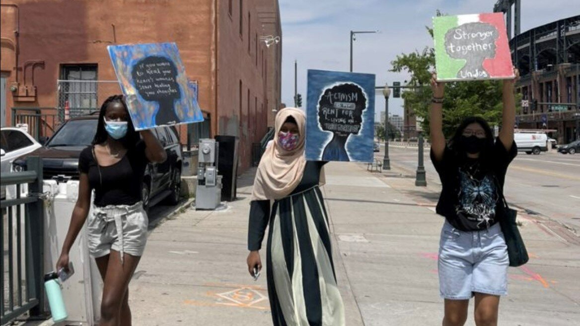 Young adults work alongside community leaders and educators to ...